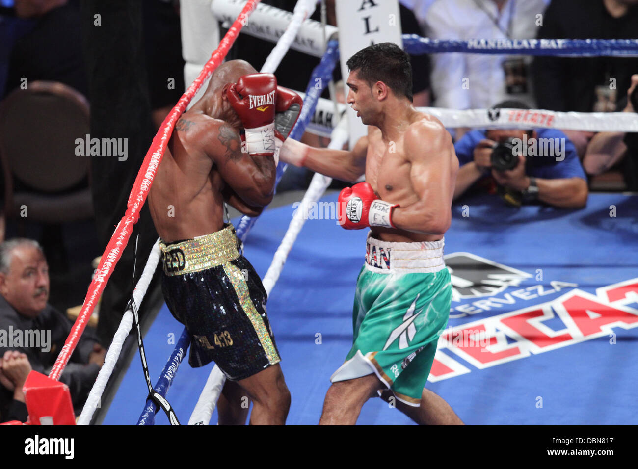 Amir Khan (green shorts) v Zab Zudah in the WBA & IBF Junior Welterweight Championship fight ...