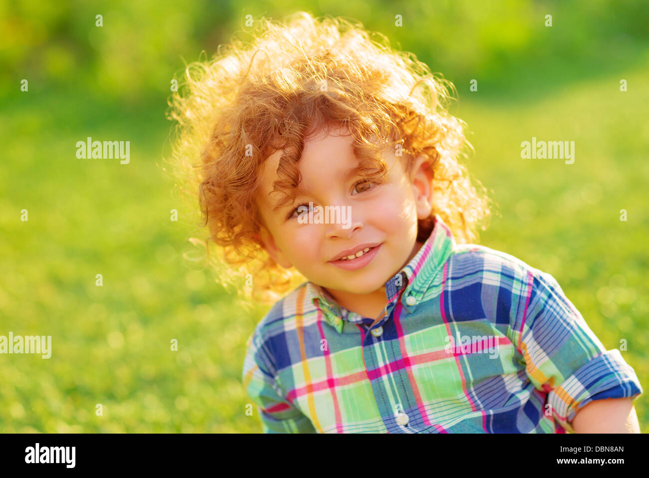 Cute cheerful boy relaxing outdoors, adorable child with beautiful ...