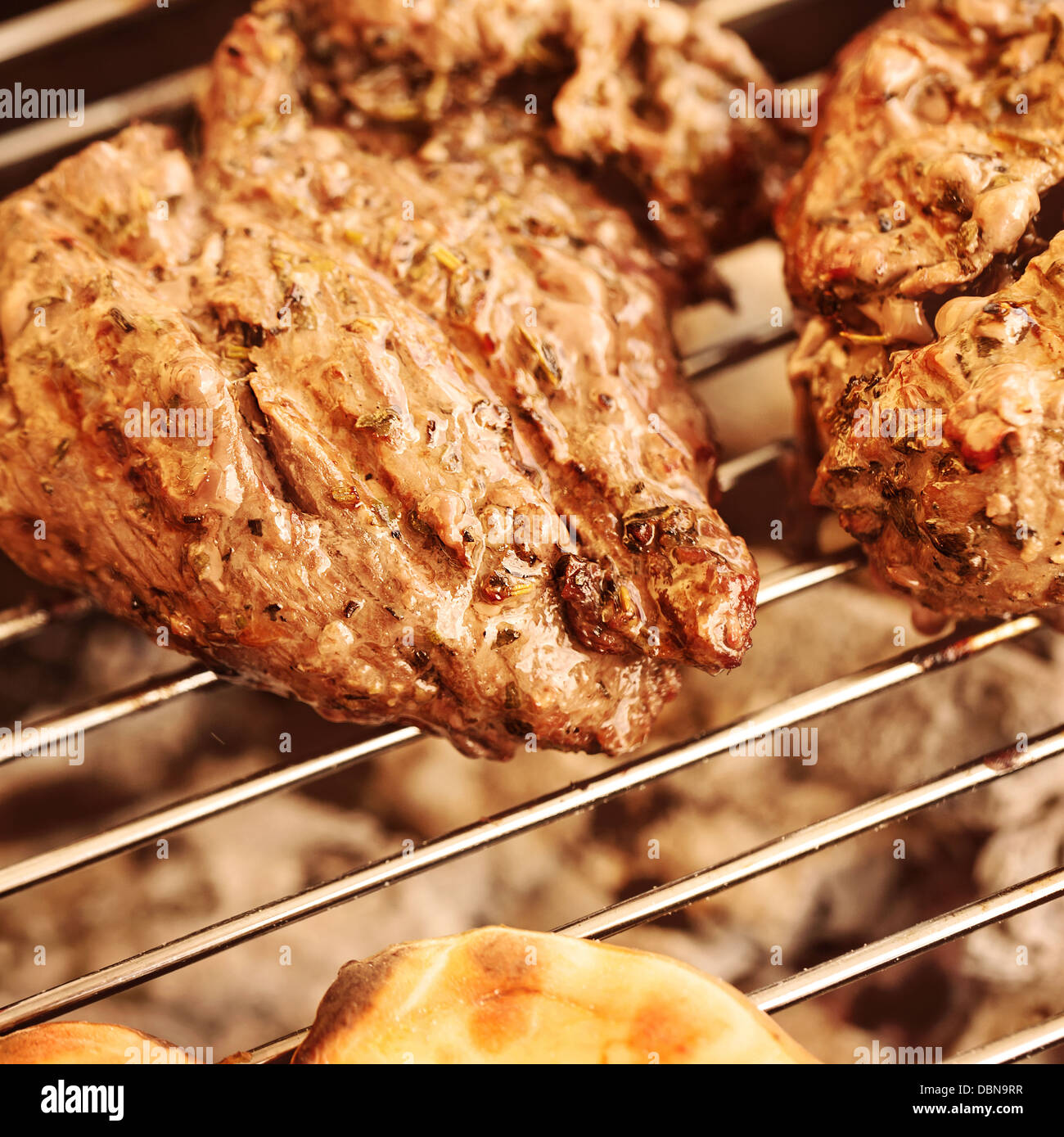 Closeup photo of tasty grilled meat on mangal, barbecue steak ...