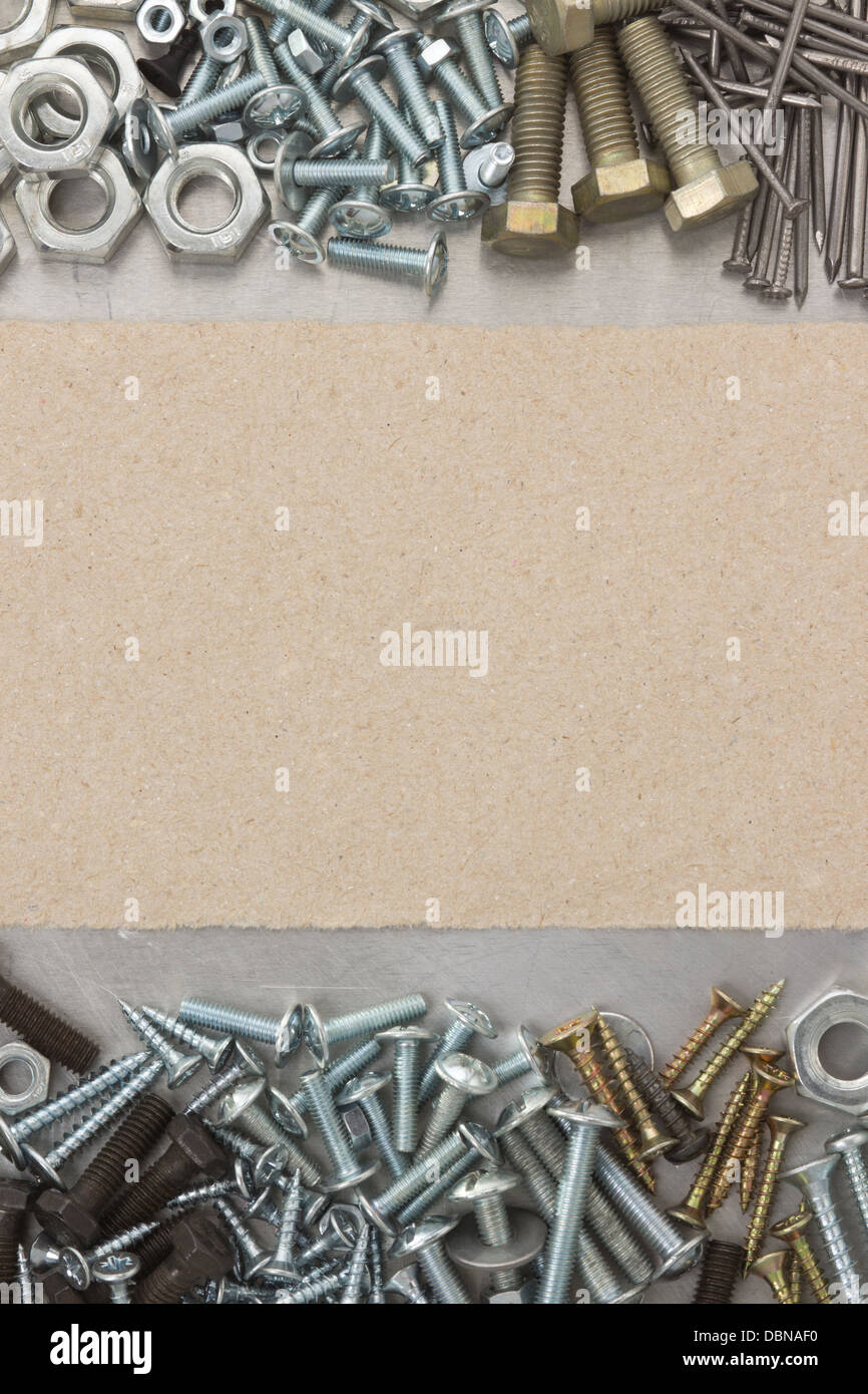 metal construction hardware tool and wrapped paper Stock Photo - Alamy