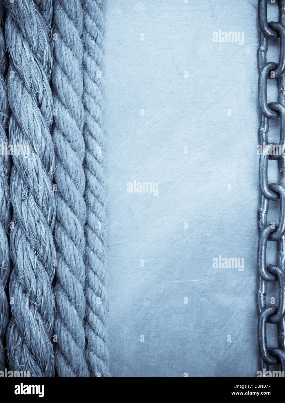 chain and ship rope on metal texture background Stock Photo - Alamy