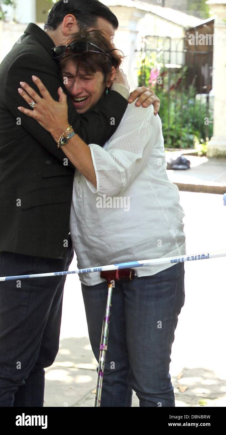 Alex Winehouse comforts mother Janis Winehouse as they read through ...