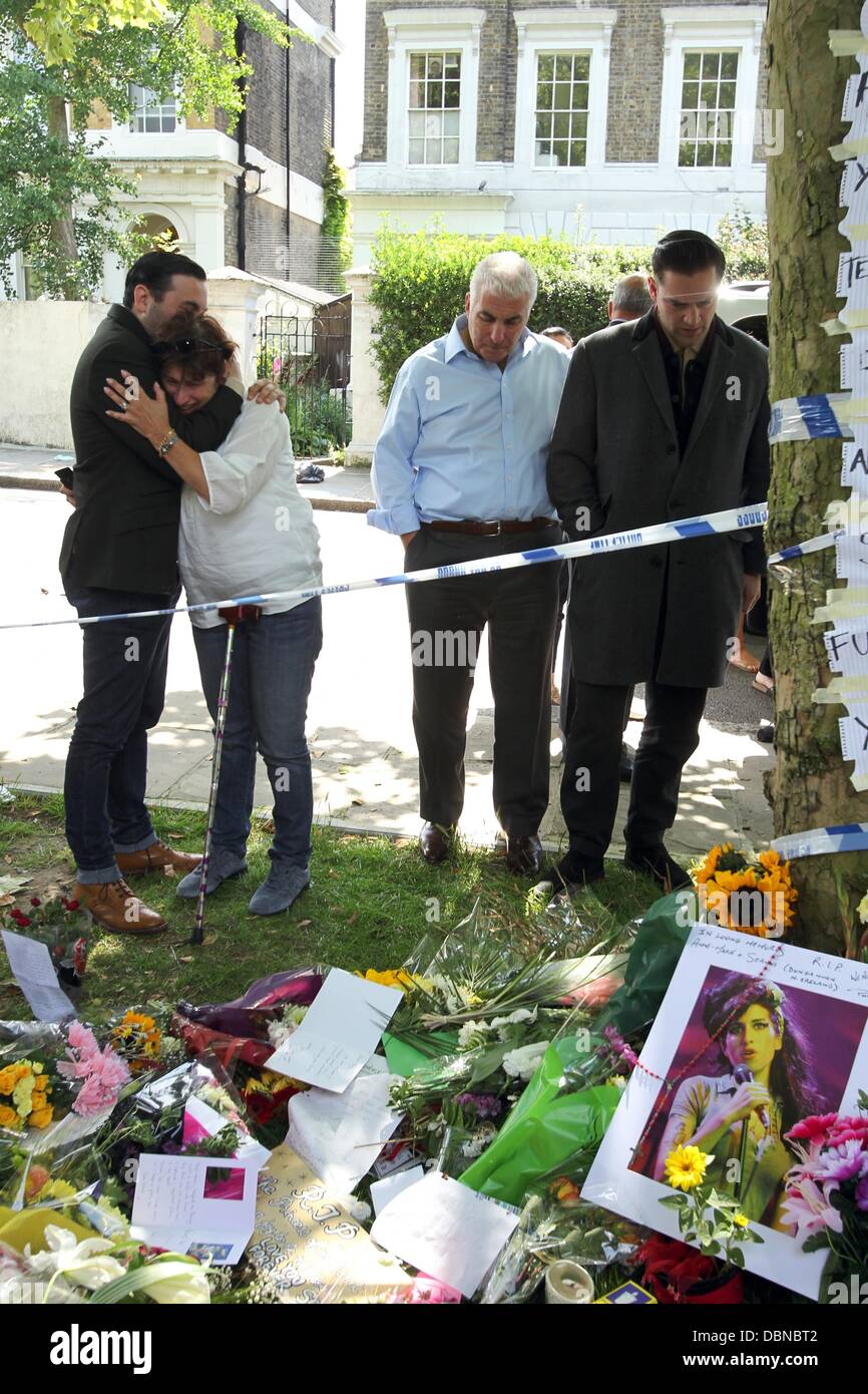 Alex Winehouse comforts mother Janis Winehouse as Mitch Winehouse ...