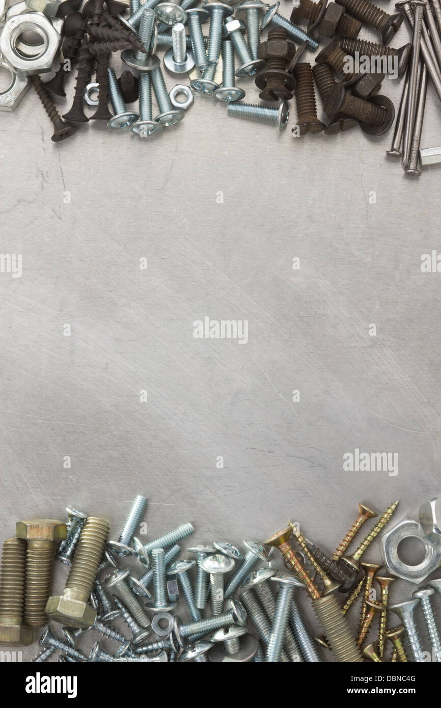metal construction hardware tool on metal texture Stock Photo - Alamy