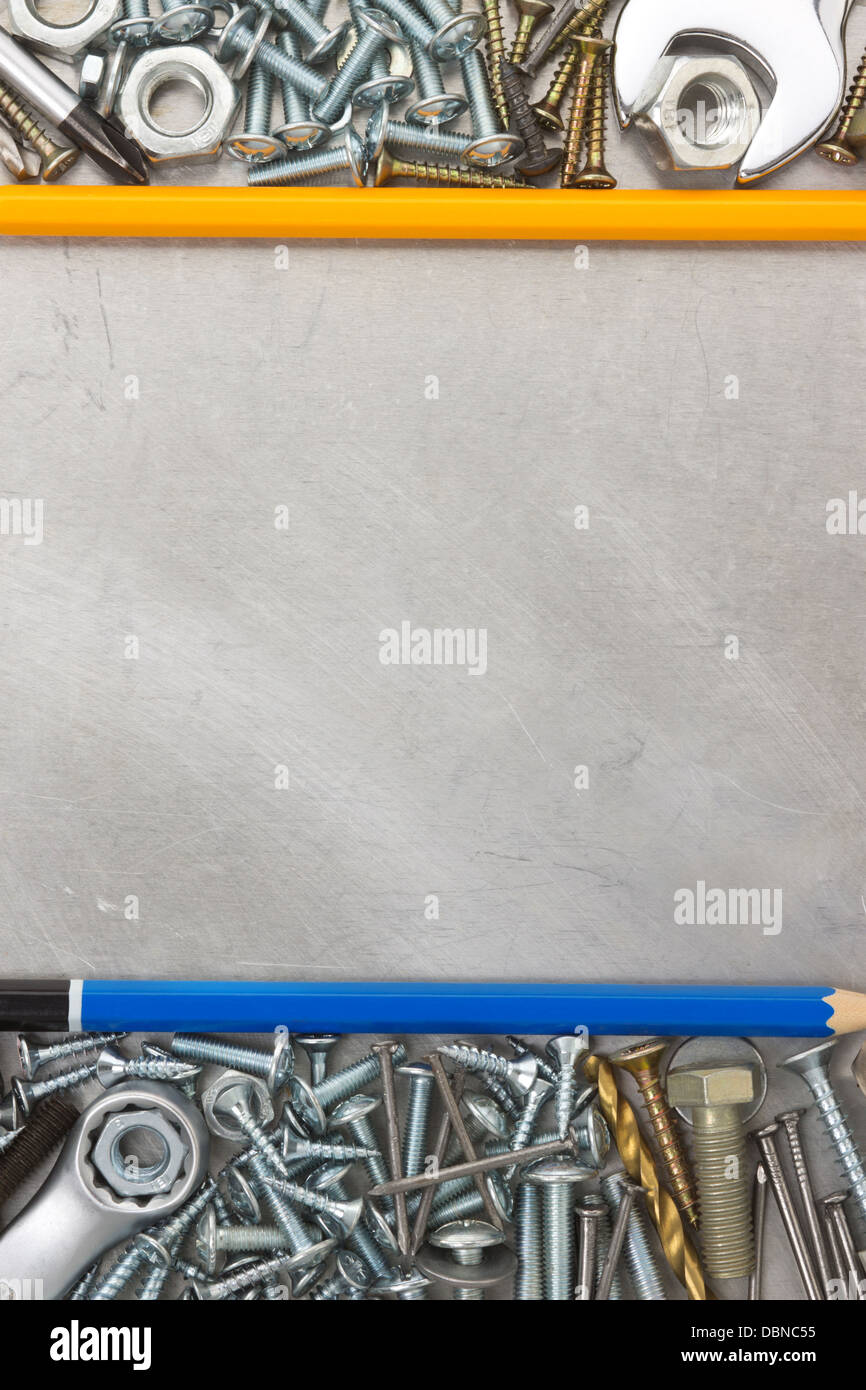 metal construction hardware tool on metal texture Stock Photo - Alamy