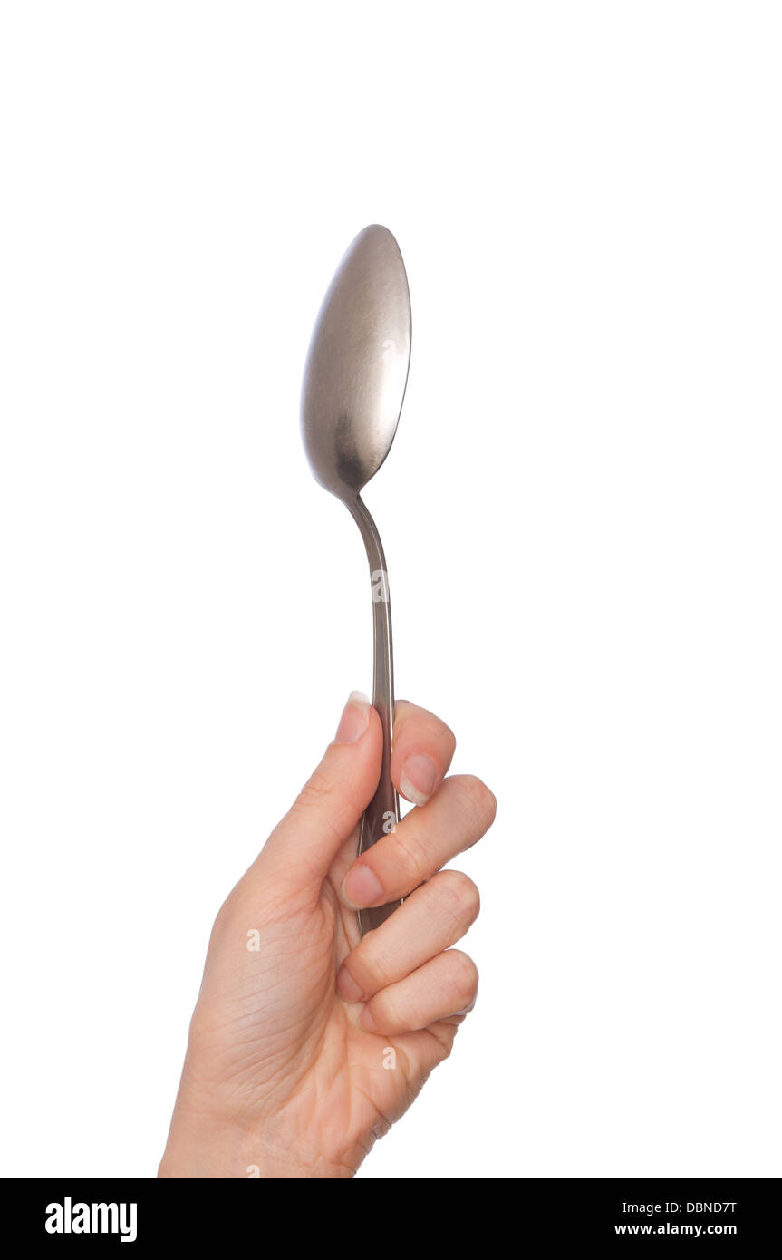 Hand holding spoon cook utensil Cut Out Stock Images & Pictures - Alamy