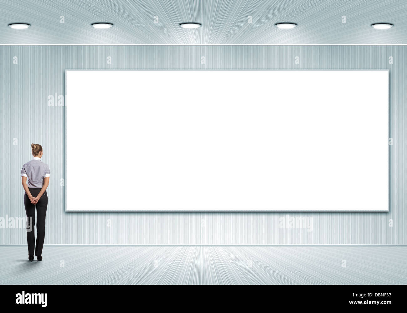 Business person standing near a blank billboard Stock Photo - Alamy
