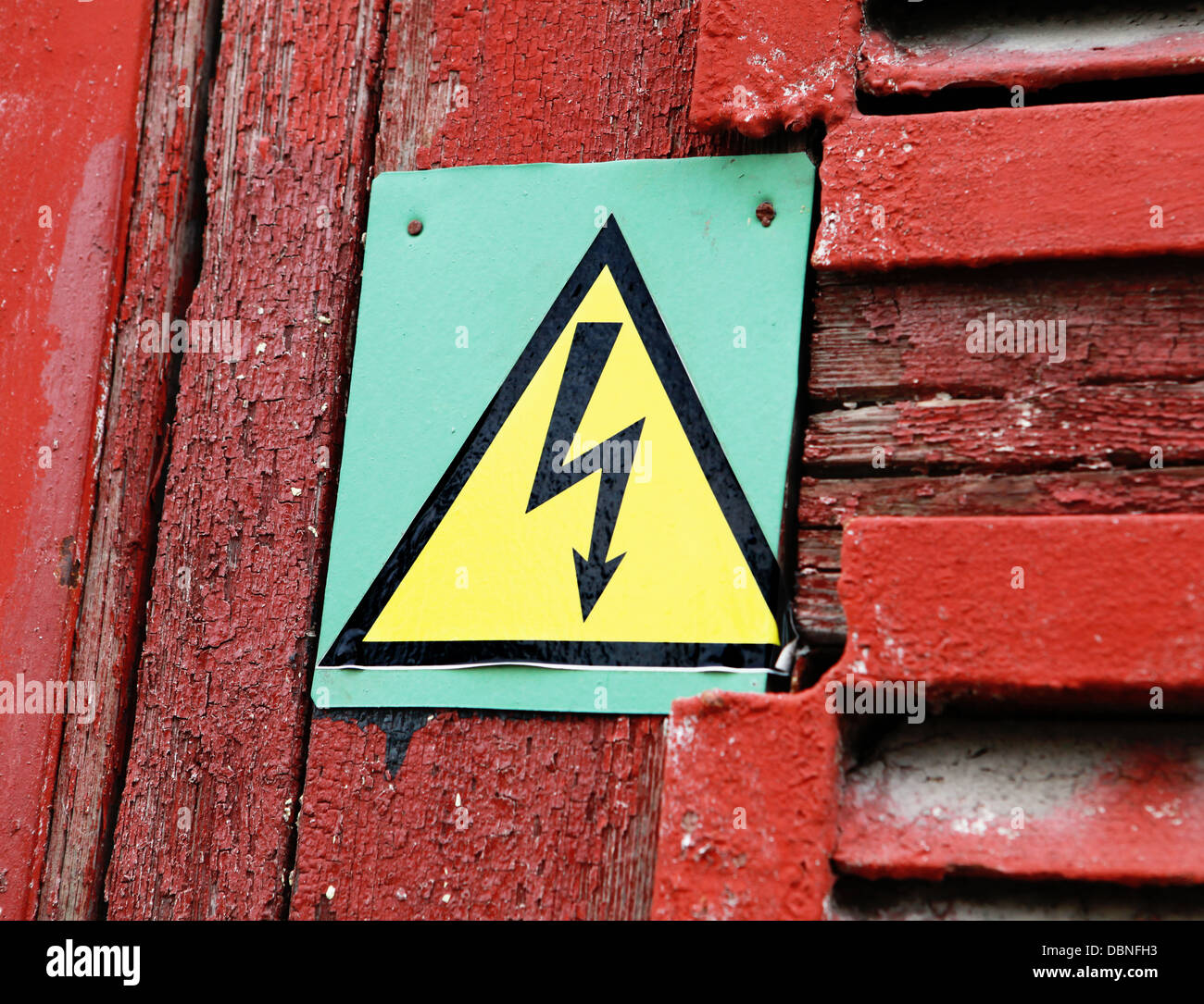 danger high voltage sign on red rusty door Stock Photo - Alamy