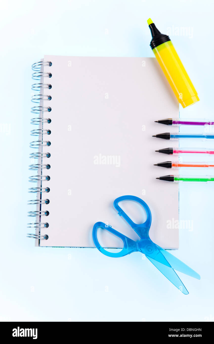 Notepad with school supplies Stock Photo - Alamy