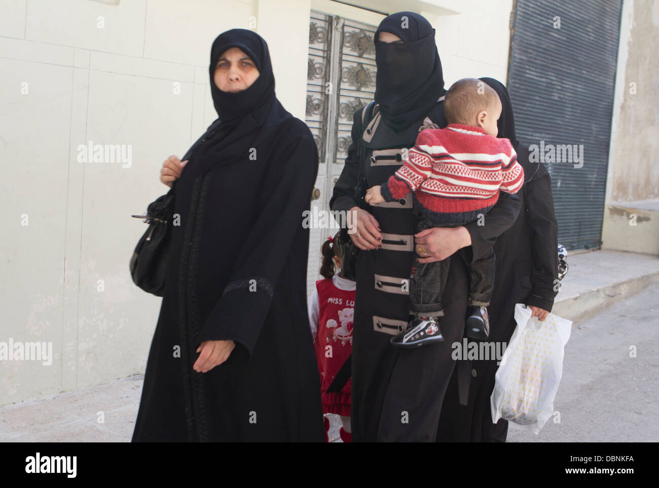 Syrian women walk on the street in Aleppo, Syria Stock Photo - Alamy