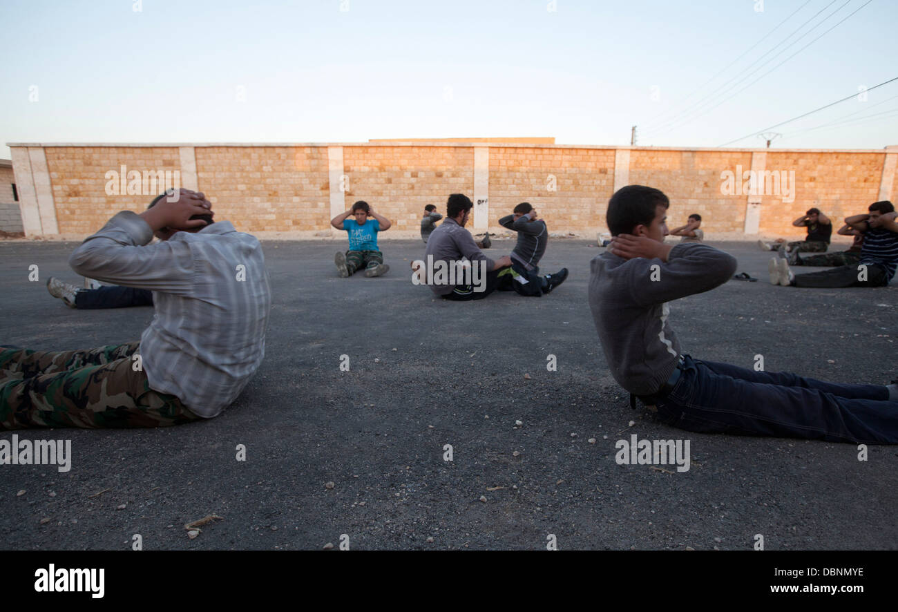 Free Syrian Army youth soldiers attend a training camp in Syria. Their ...