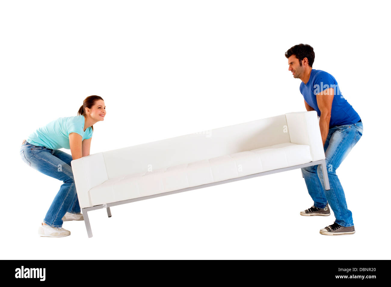 Couple carrying a sofa Stock Photo - Alamy