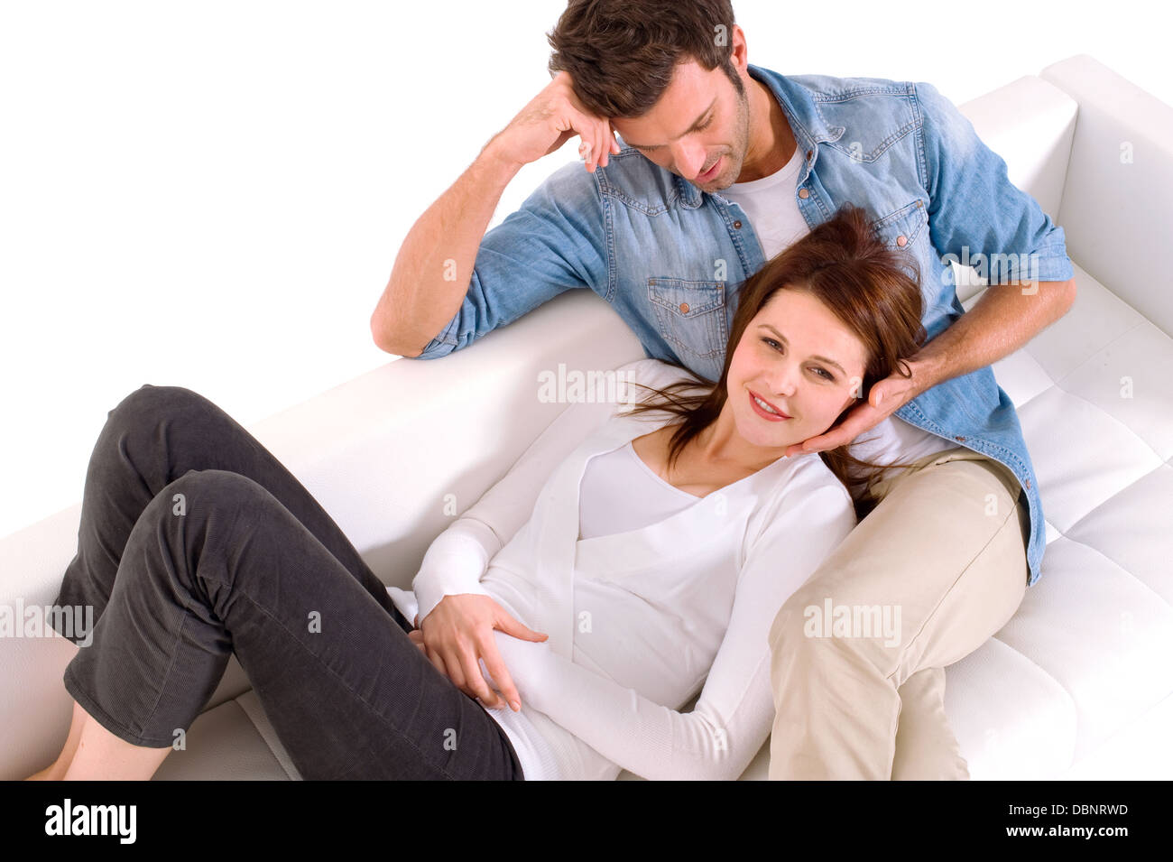couple on the couch pampering Stock Photo - Alamy