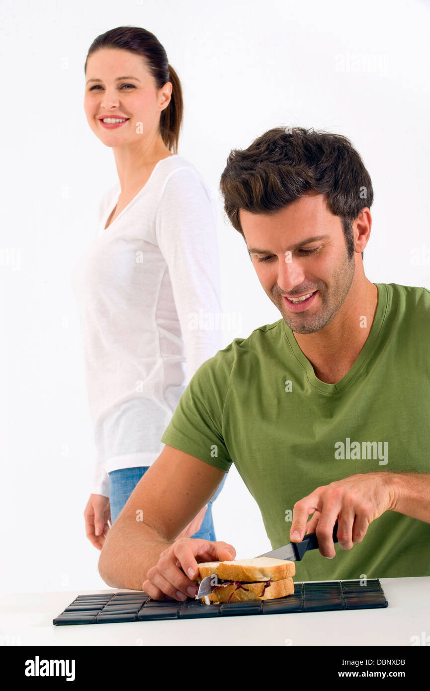 Couple preparing a sandwich Stock Photo - Alamy