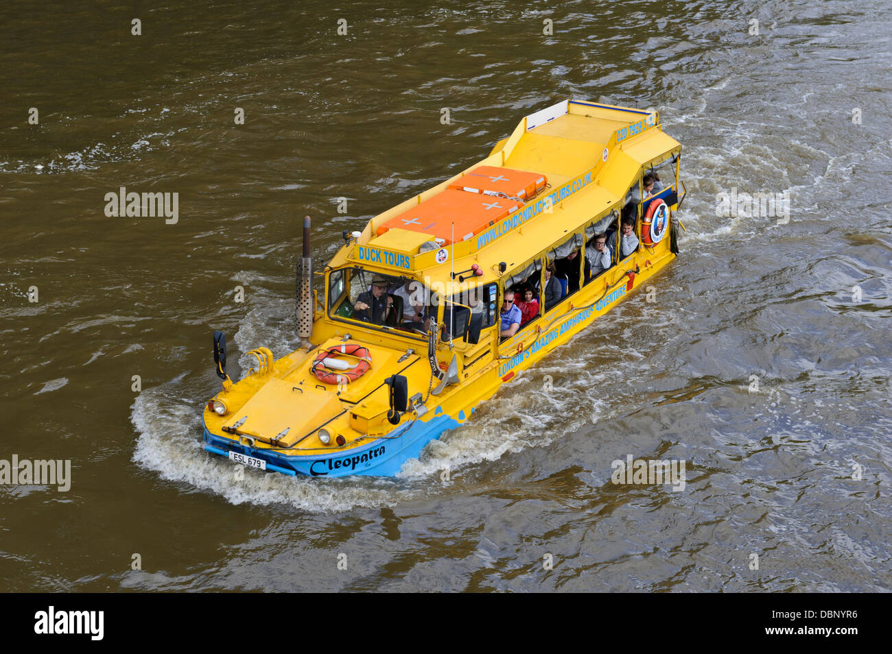 Tourists in amphibious vehicle on the Thames river, London, England ...