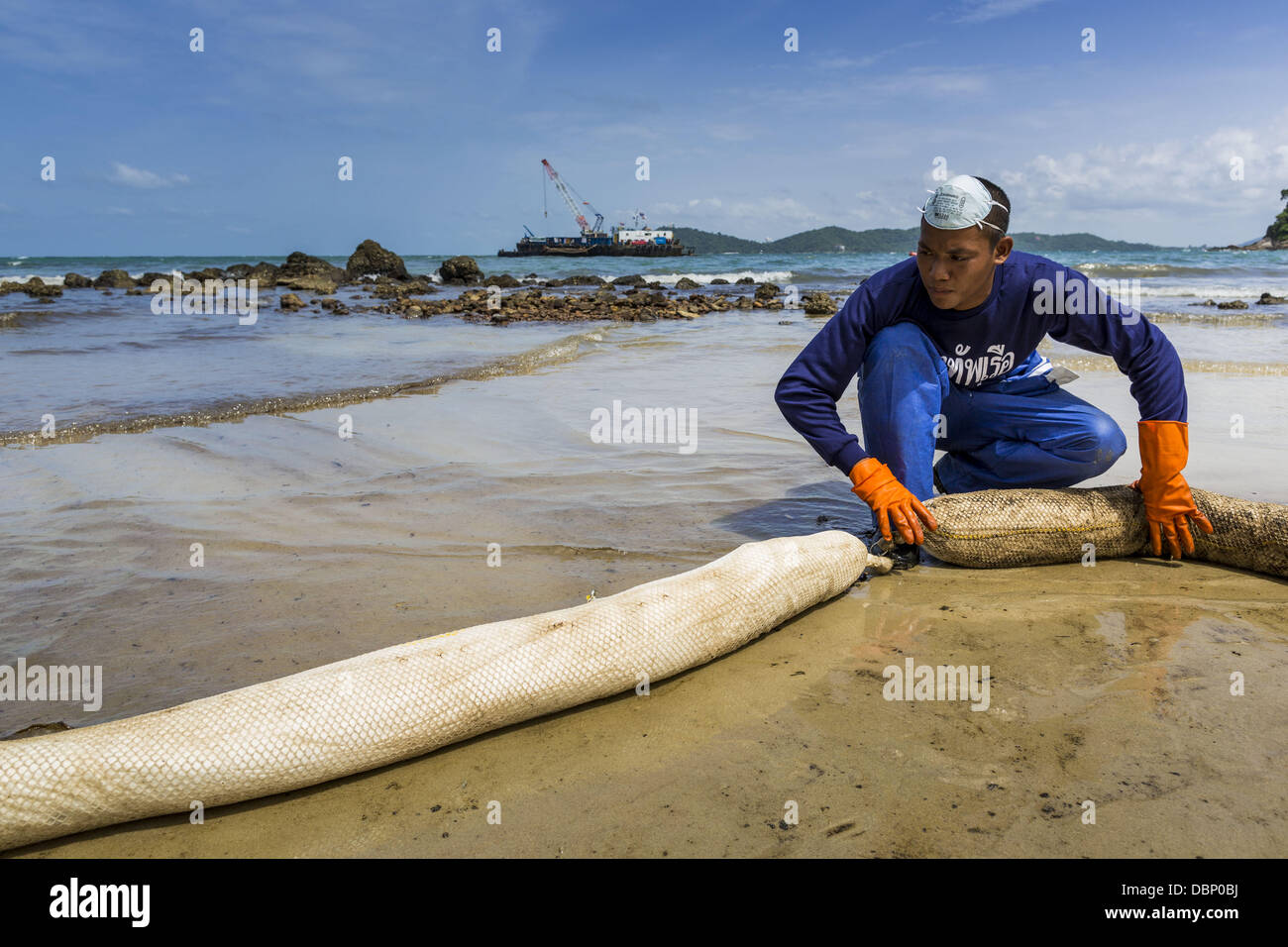 Koh Samet, Rayong, Thailand. 2nd Aug, 2013. A worker lays out ...