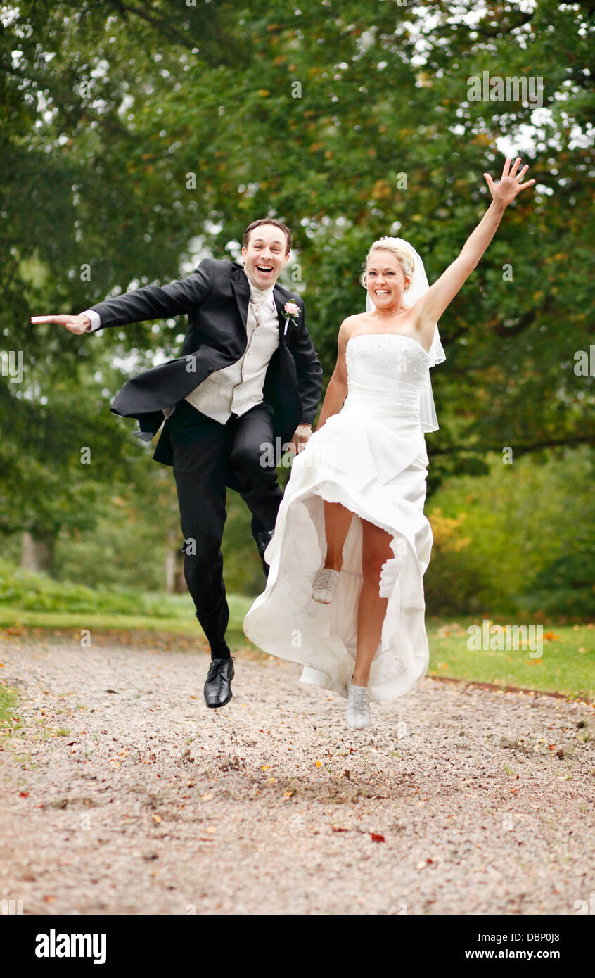 Happy wedding jumping groom hi-res stock photography and images - Alamy