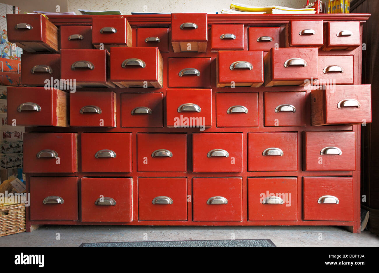 Wooden cabinet with opened drawers Stock Photo - Alamy