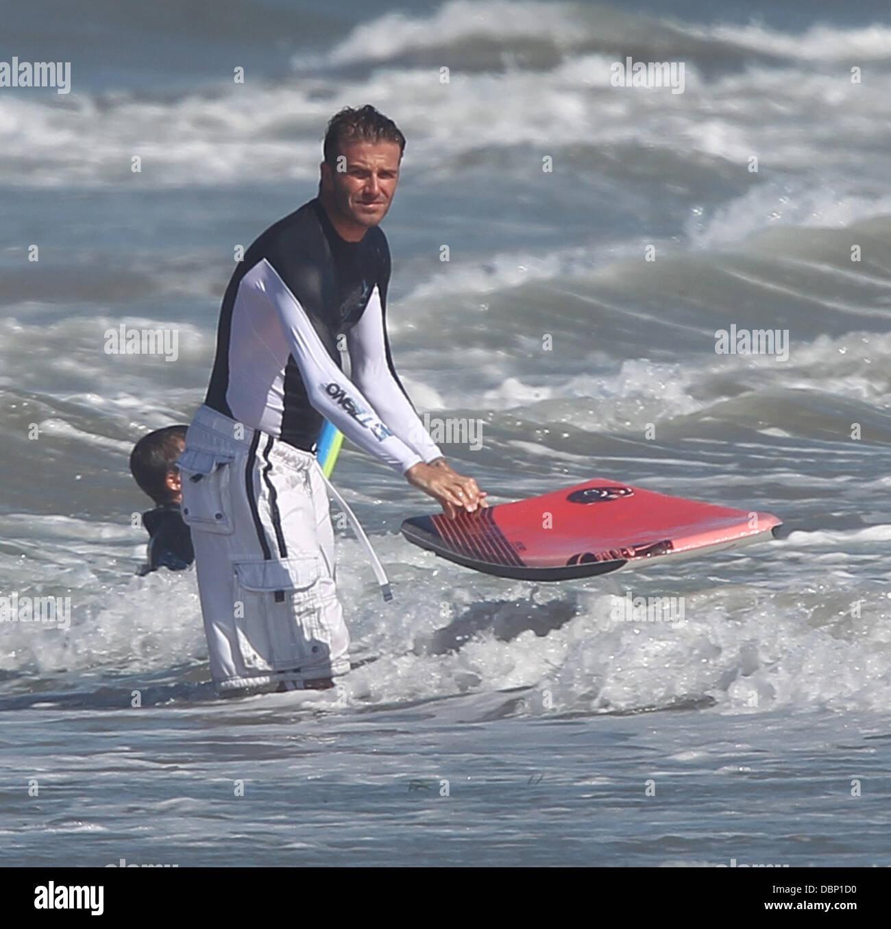 David Beckham bodyboarding on Malibu Beach Los Angeles, California, USA ...
