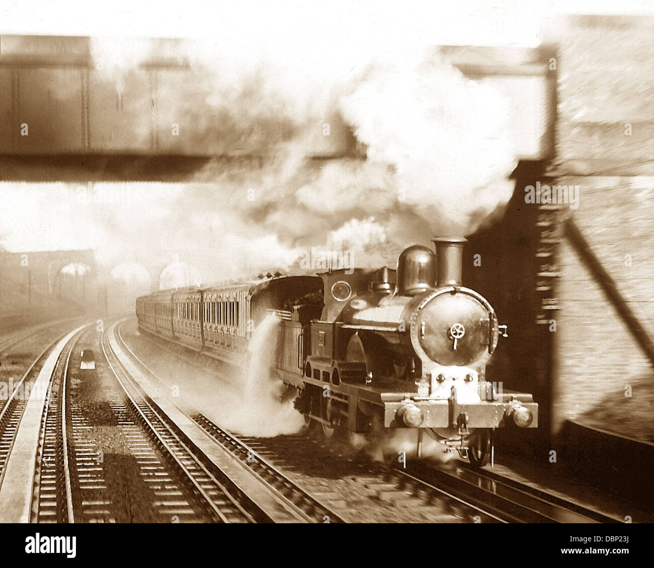 Bushey Steam Train picking up water early 1900s Stock Photo - Alamy