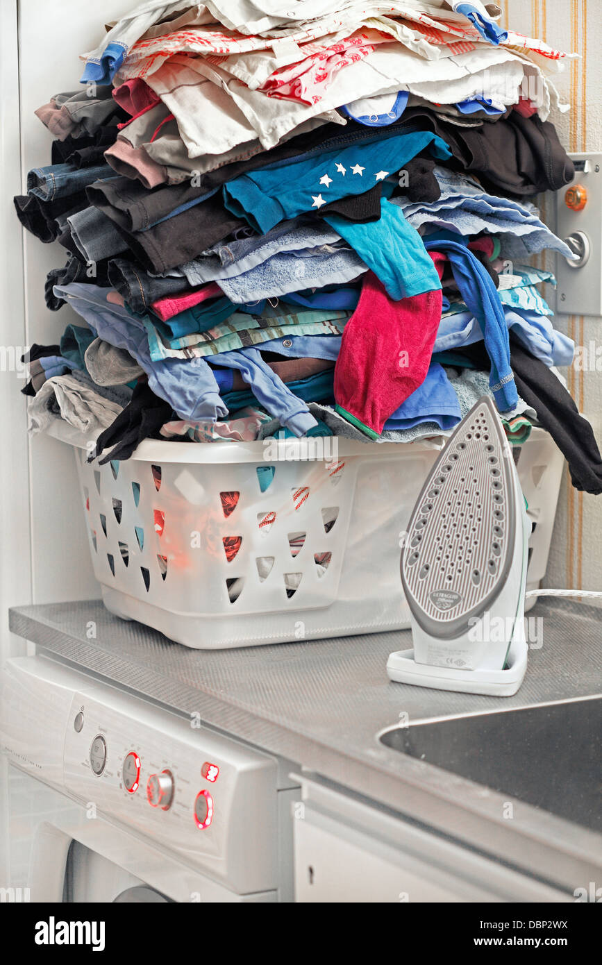 Stack of laundry ready to be ironed hi-res stock photography and images ...