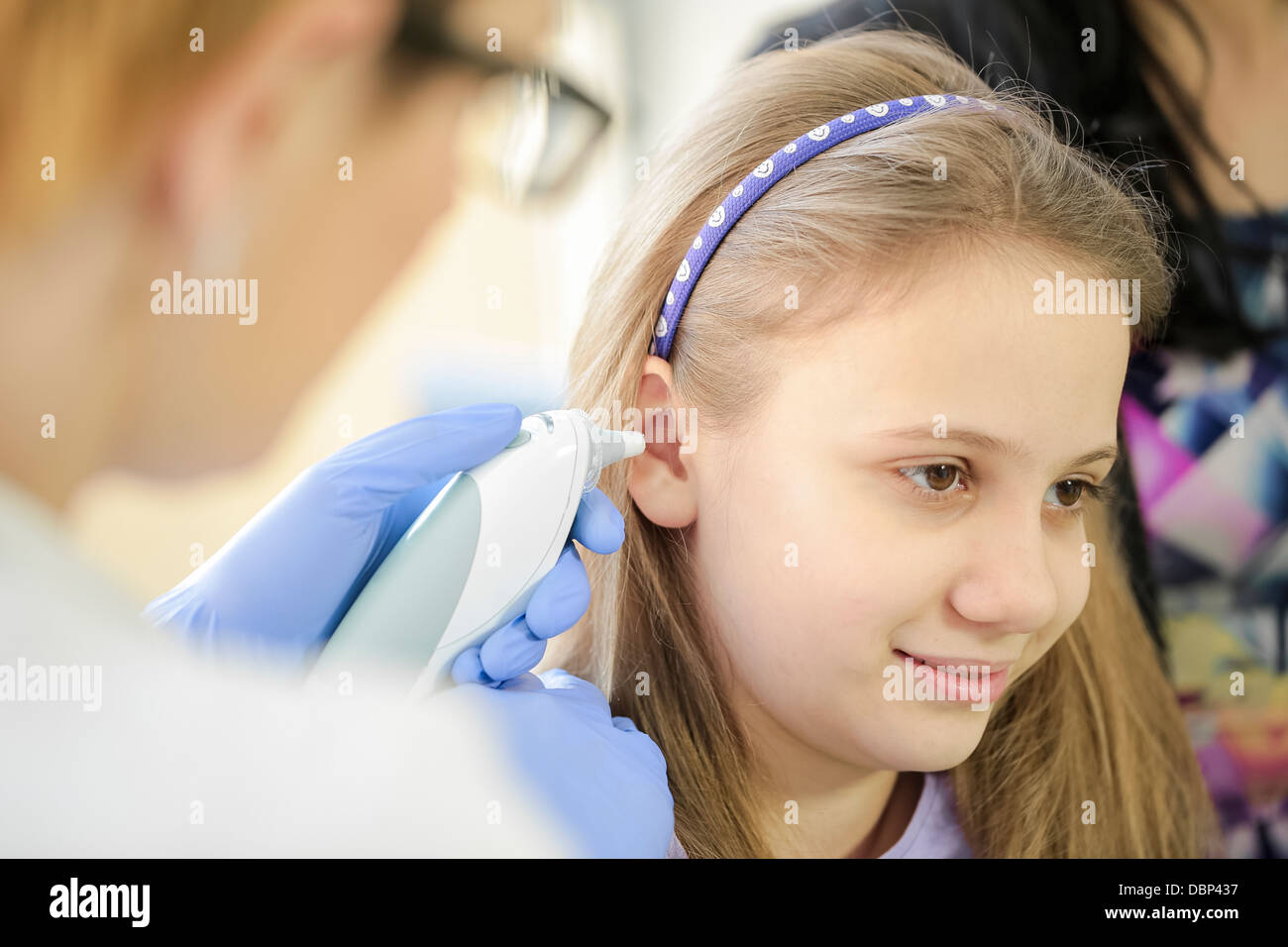 Female doctor examining girls ear, Osijek, Croatia Stock Photo - Alamy