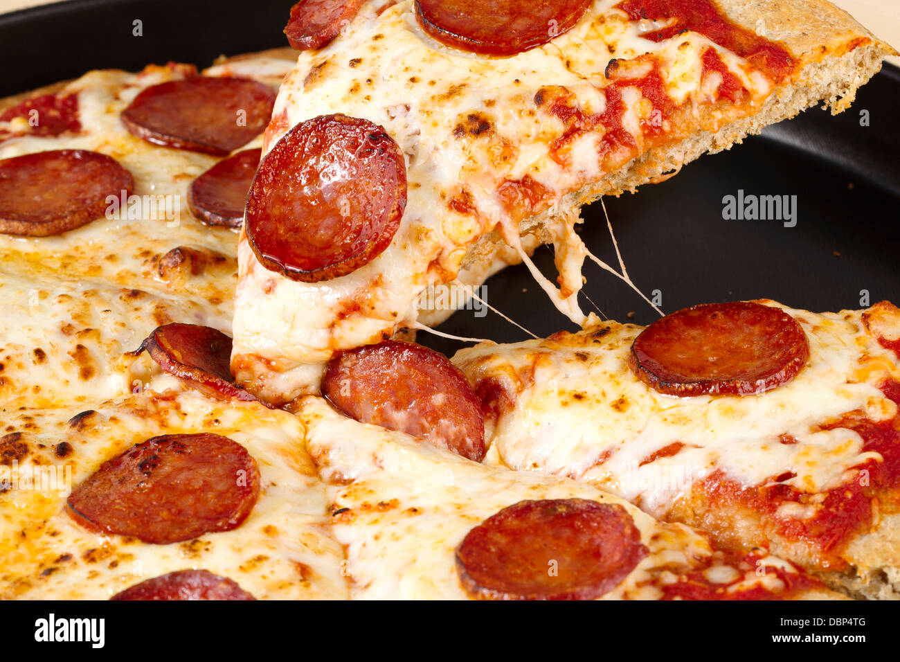slice of pepperoni pizza Stock Photo - Alamy