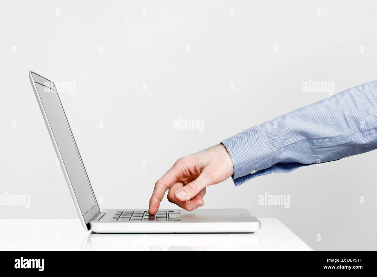 Human hand on laptop Stock Photo - Alamy