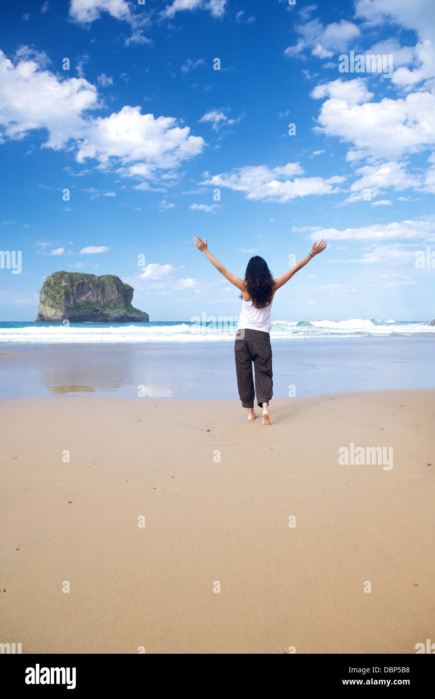 woman open arms in Ballota beach Stock Photo - Alamy