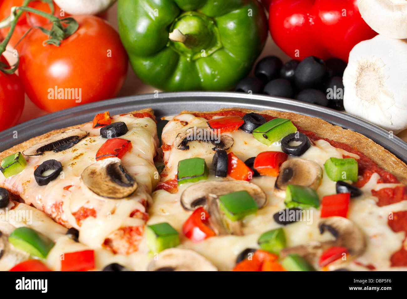 cropped image of supreme pizza Stock Photo - Alamy