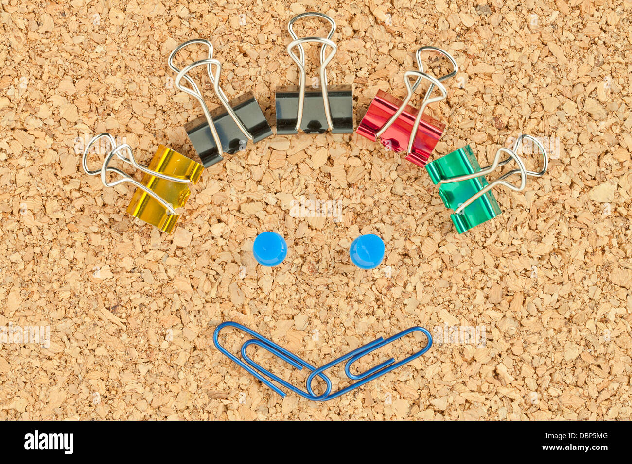 happy face made of colorful clips Stock Photo - Alamy