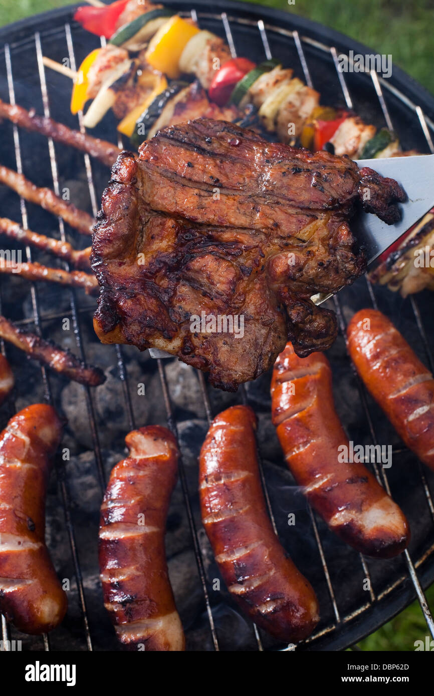 Cooking on the barbecue grill Stock Photo - Alamy