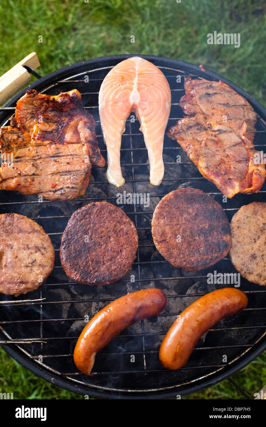 Cooking on the barbecue grill Stock Photo - Alamy