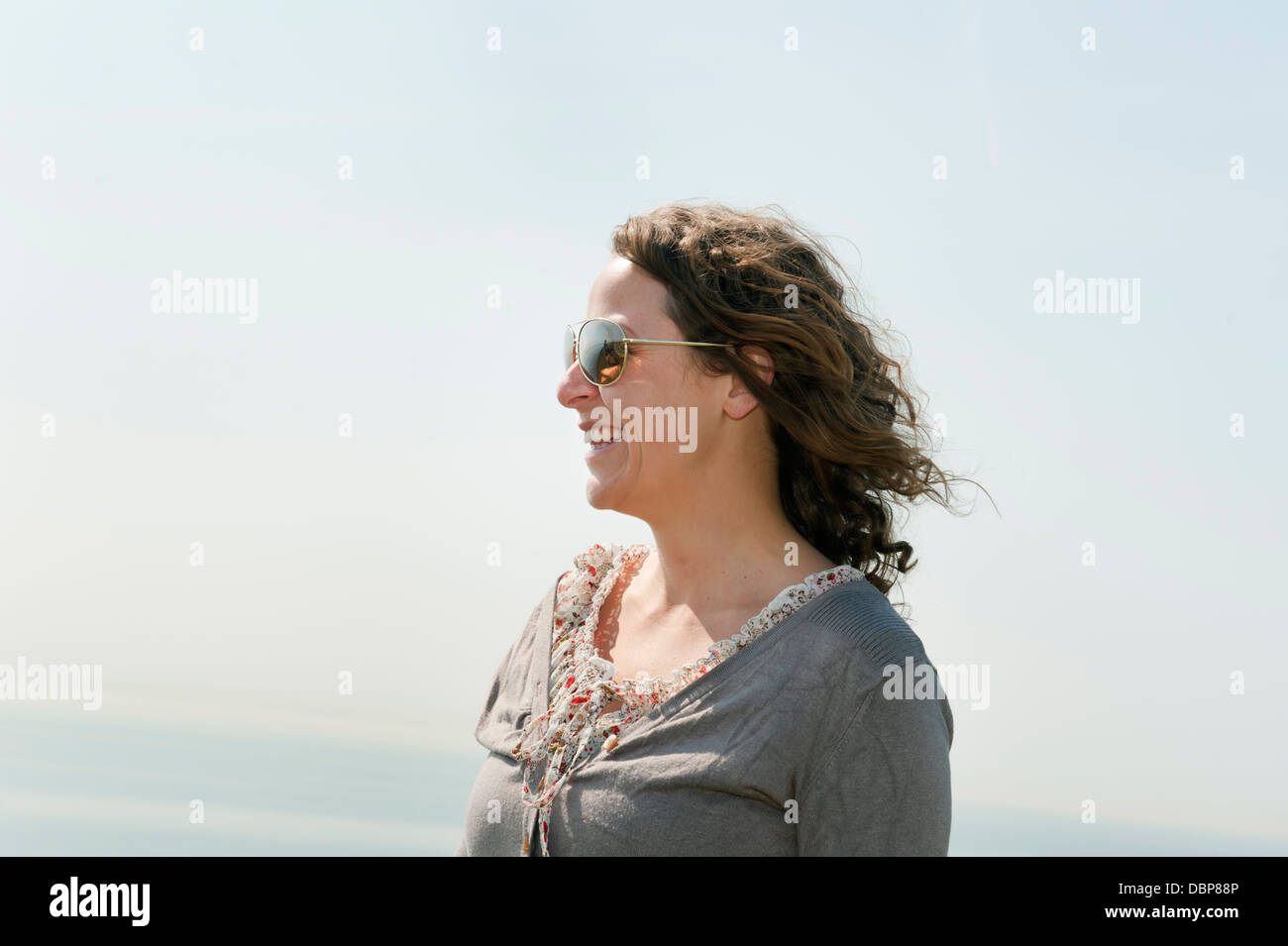 Profile of smiling woman Stock Photo - Alamy