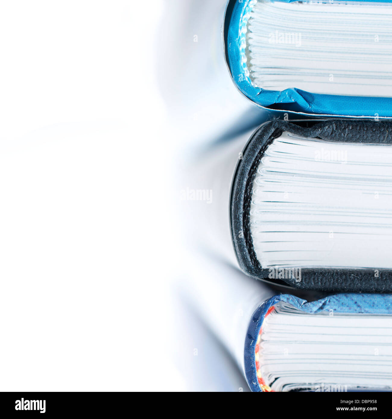 forefront of a group of books stacked Stock Photo - Alamy