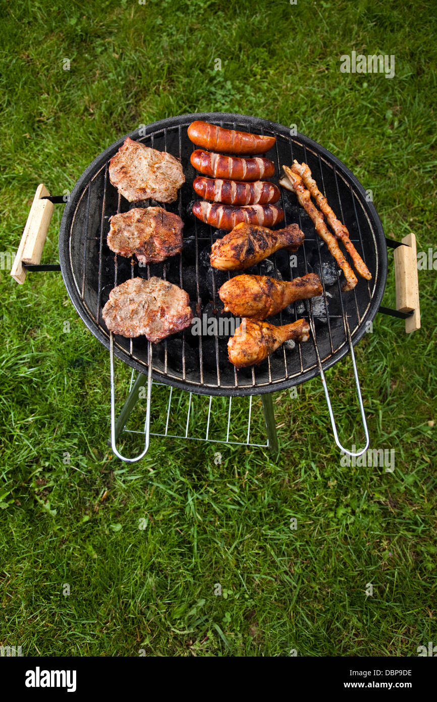 Closeup of meat on grill Stock Photo - Alamy