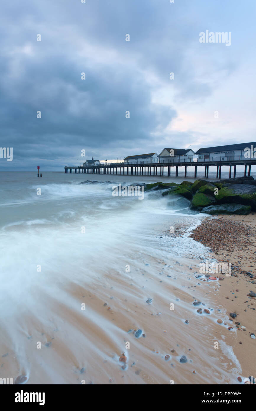 Backwash of wave on the beach at Southwold with the pier in the ...