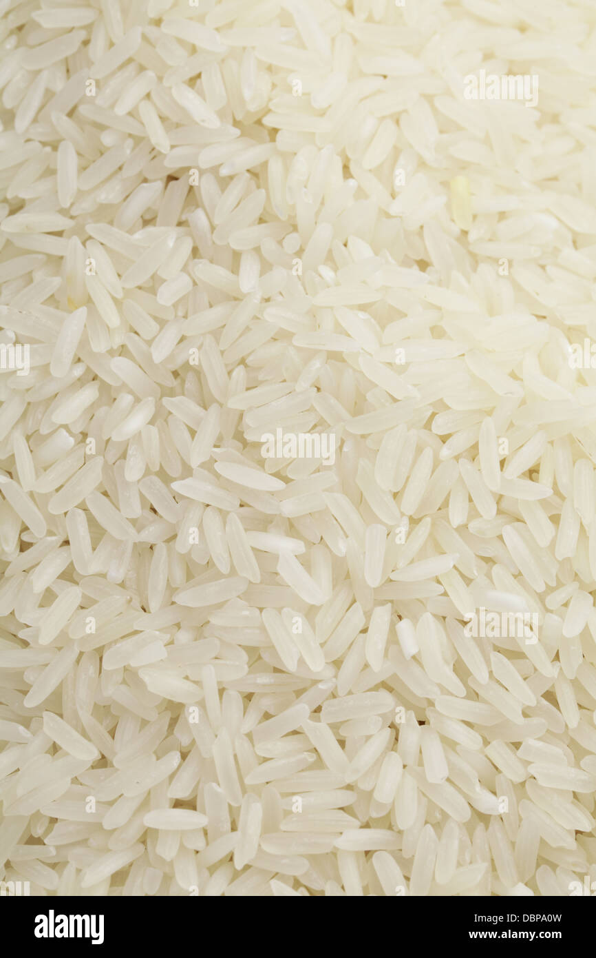 Background of the raw rice Stock Photo - Alamy