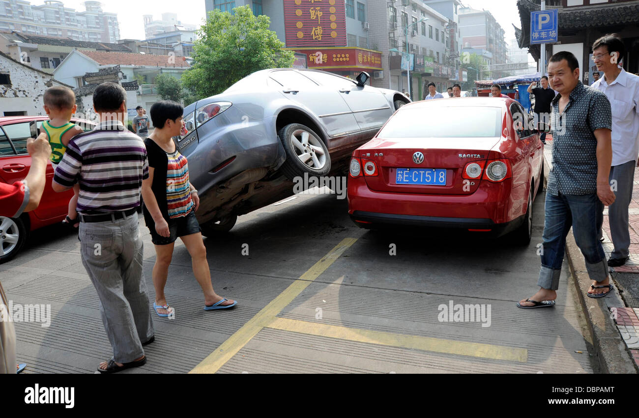 Stunt or Accident? Pedestrians standing in Zhangfu Lane of Dongyang ...
