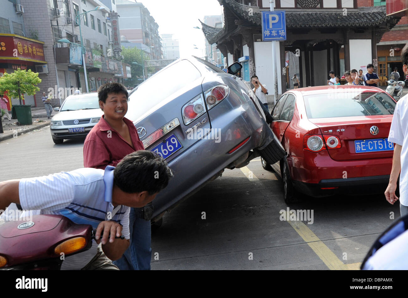 Stunt or Accident? Pedestrians standing in Zhangfu Lane of Dongyang ...
