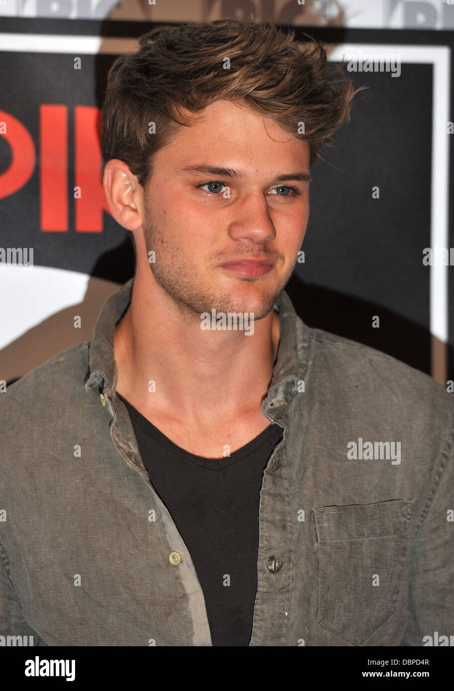 Jeremy Irvine poses for photographers before an 'Empire Big Screen ...