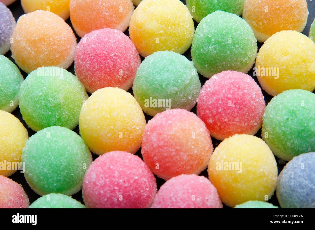 aligned group of different colors of jelly beans Stock Photo - Alamy