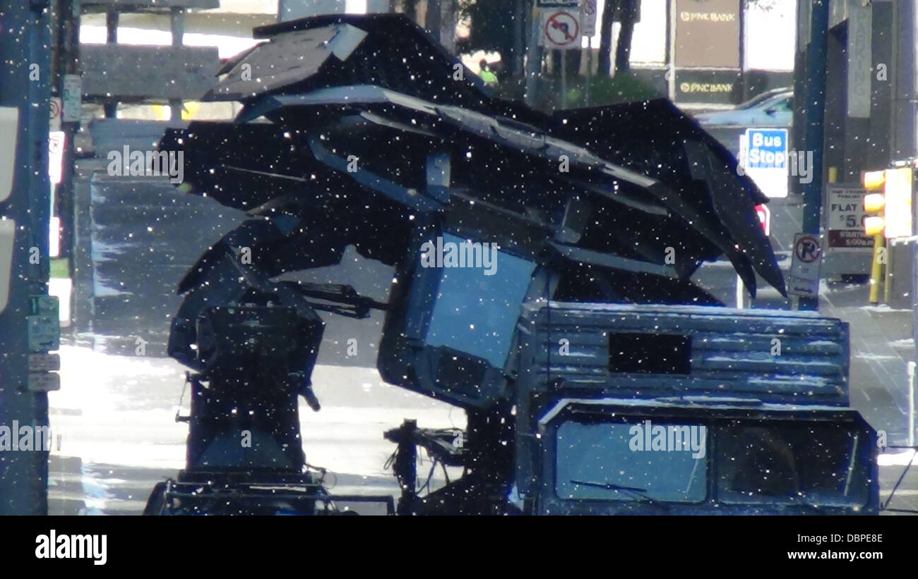 The Batplane is transported through a scene with a Batman figure in the ...