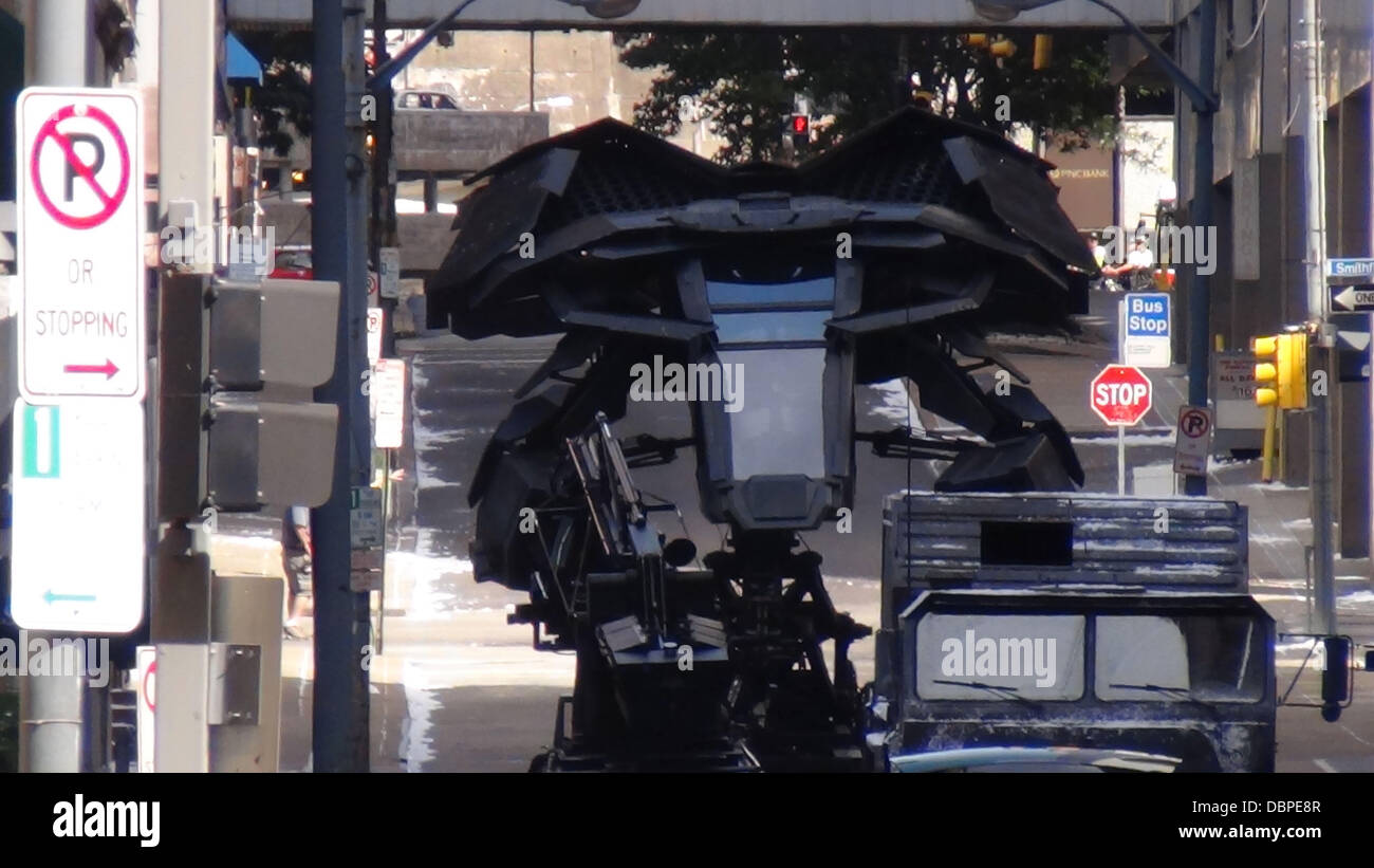 The Batplane is transported through a scene with a Batman figure in the ...