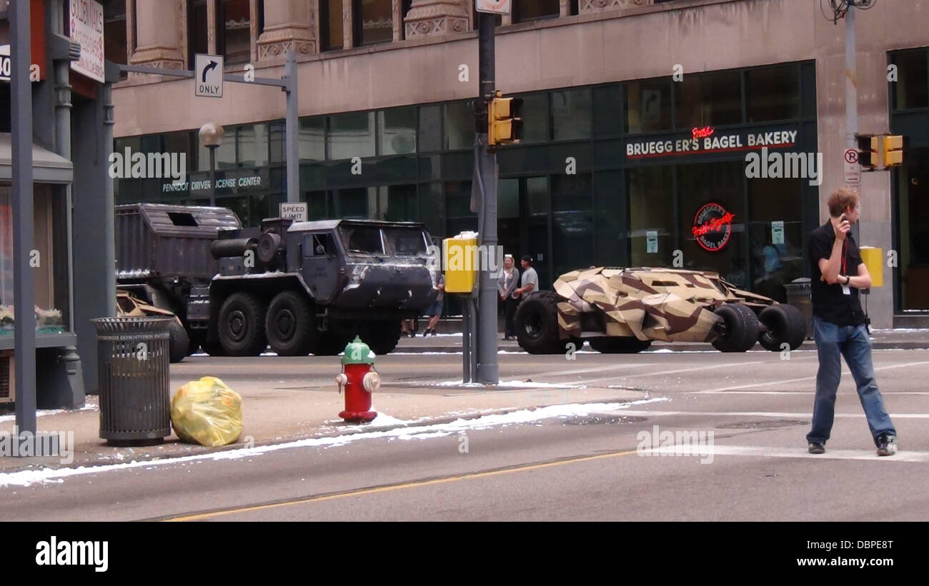 The Batplane is transported through a scene with a Batman figure in the ...