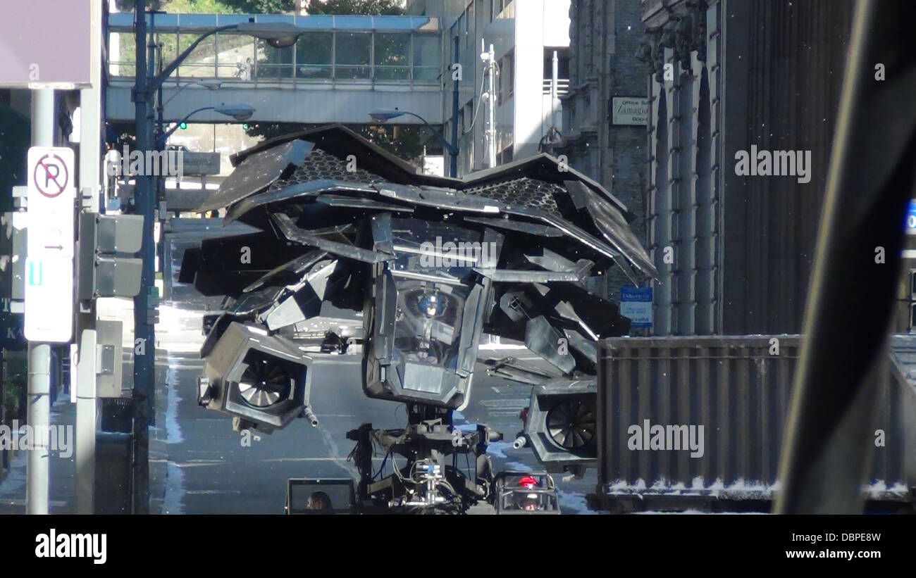 The Batplane is transported through a scene with a Batman figure in the ...