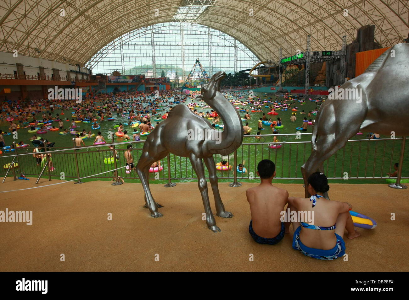 Giant Salty Swimming Pool Two swimmers rest by sculptures beside a ...