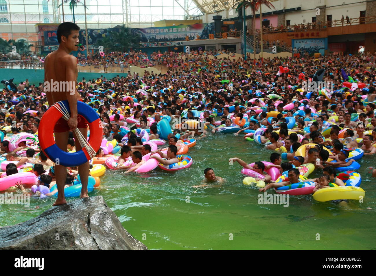 Giant Salty Swimming Pool A lifeguard looks on at swimmers at a salty ...