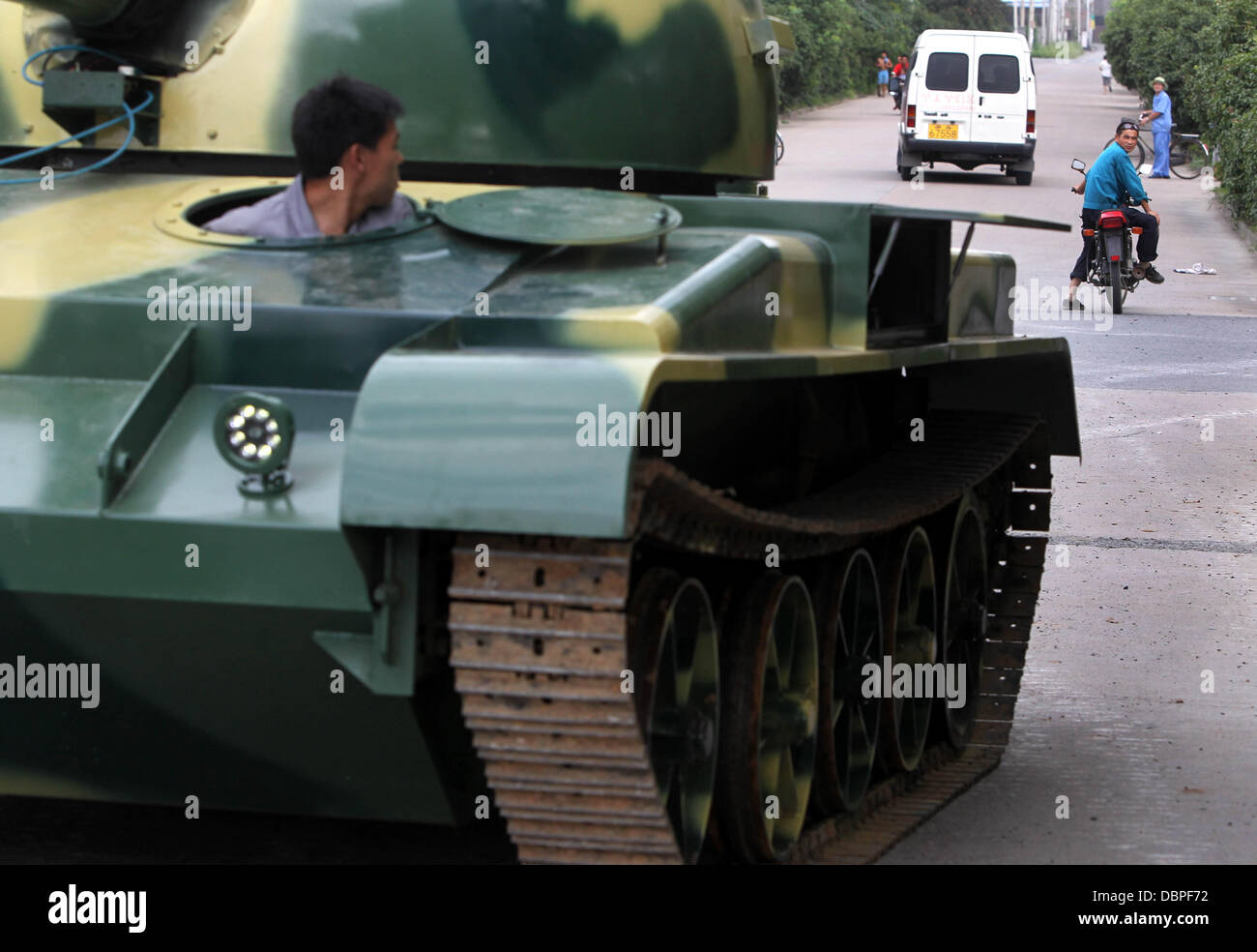 HOMEMADE TANK TAKES TO THE STREETS Residents of Hangzhou, China, may ...
