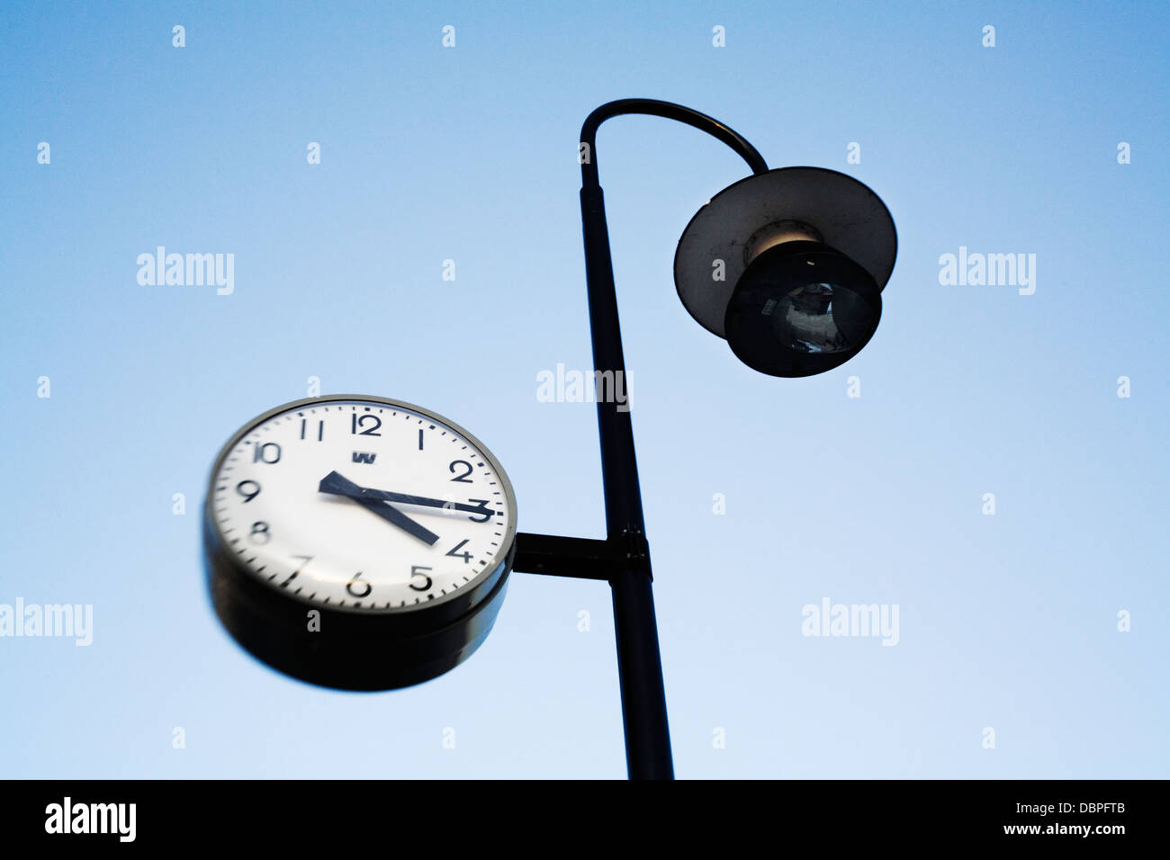 Street light with clock Stock Photo - Alamy